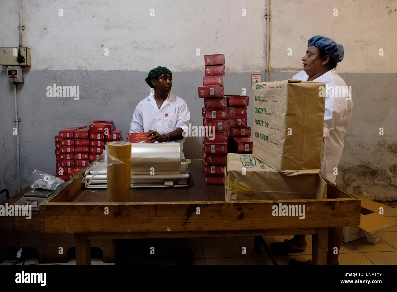 Women working at the assembly line of SeyTe tea factory in Mahe Island ...