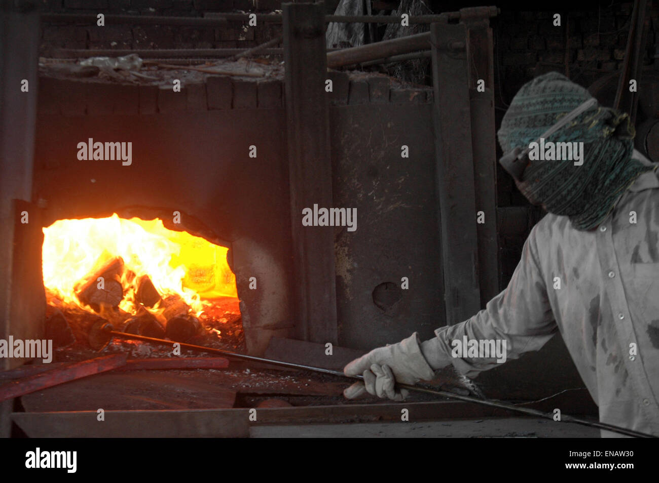 Lahore. 1st May, 2015. A Pakistani worker works at an iron factory on ...