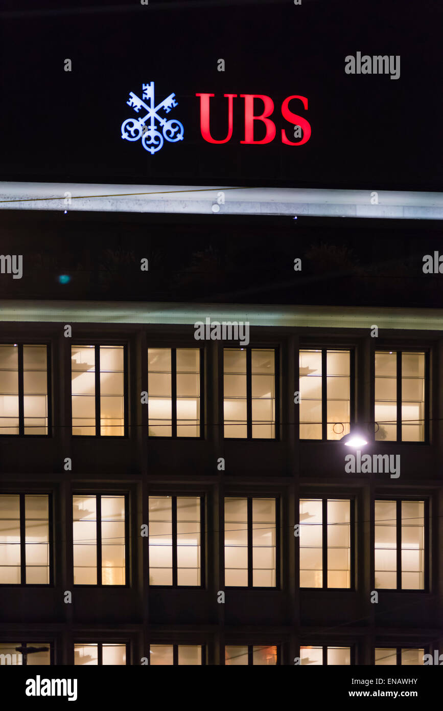 The red neon logo of UBS, Switzerland's largest bank, is shining in the ...