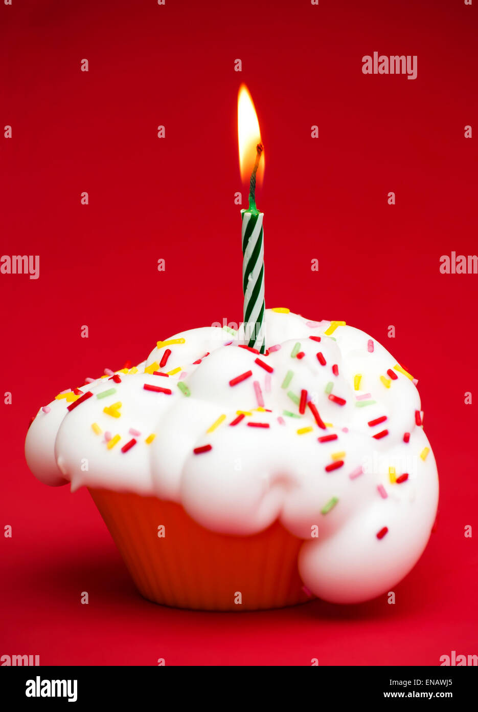 Birthday cupcake over red background Stock Photo - Alamy