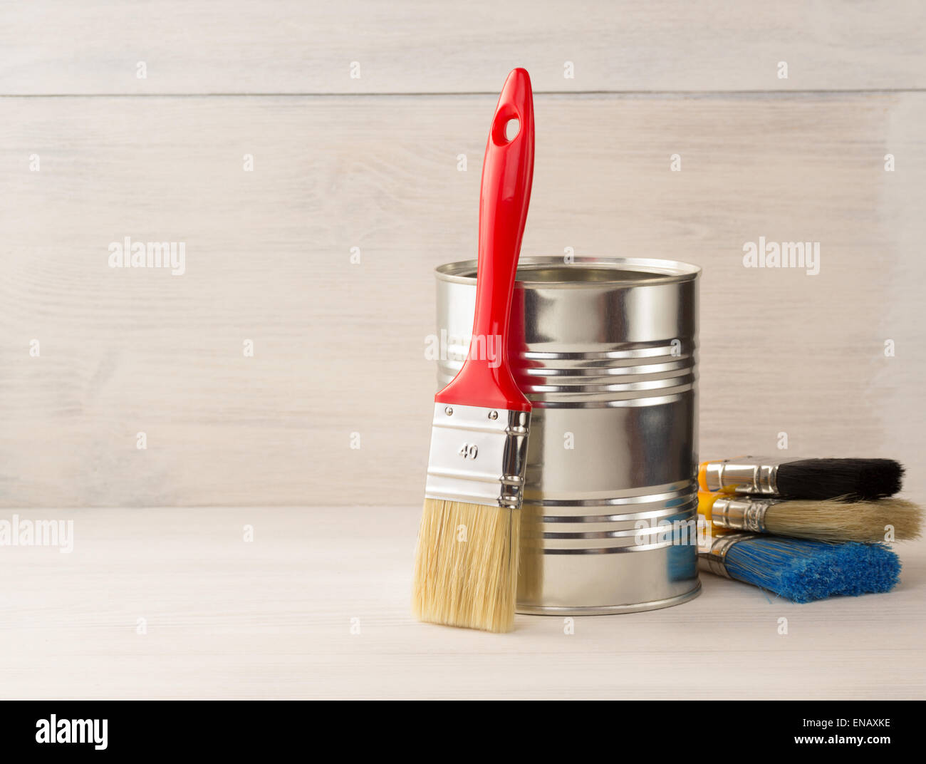 paint bucket and paintbrush on wooden background Stock Photo - Alamy