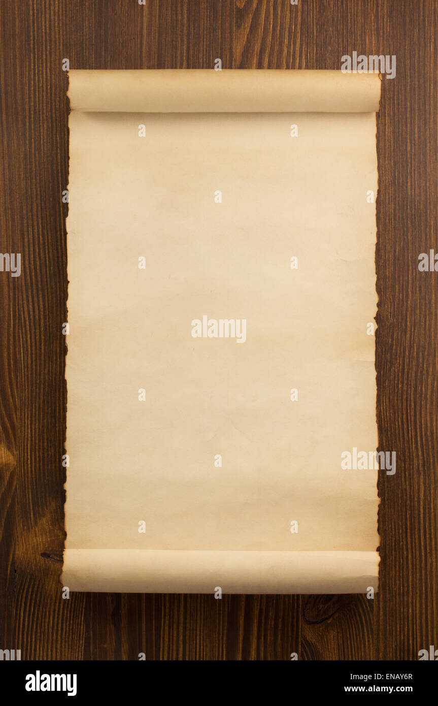 parchment scroll on wooden background Stock Photo - Alamy