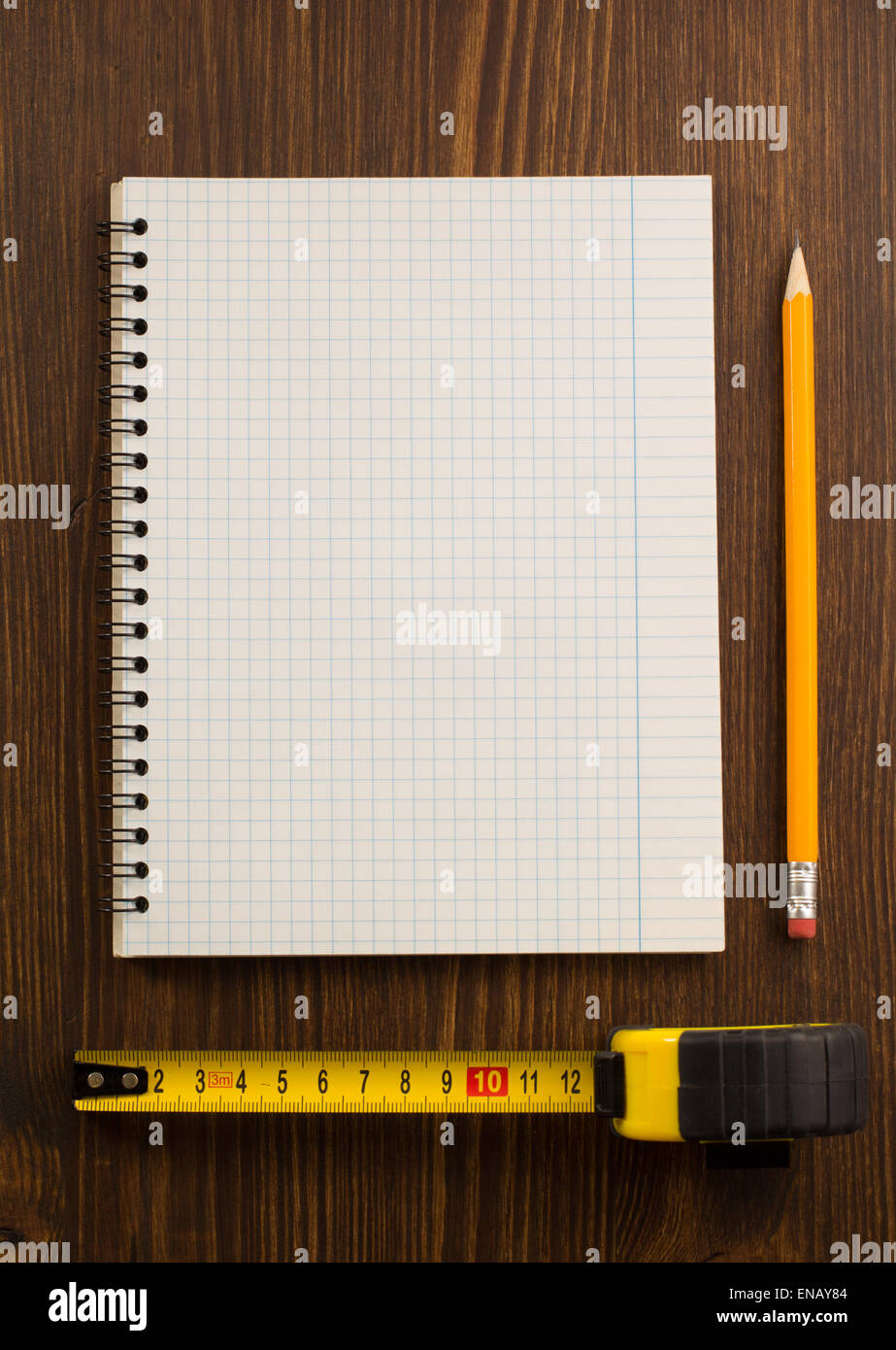 tape measure and pencil on wooden texture Stock Photo - Alamy