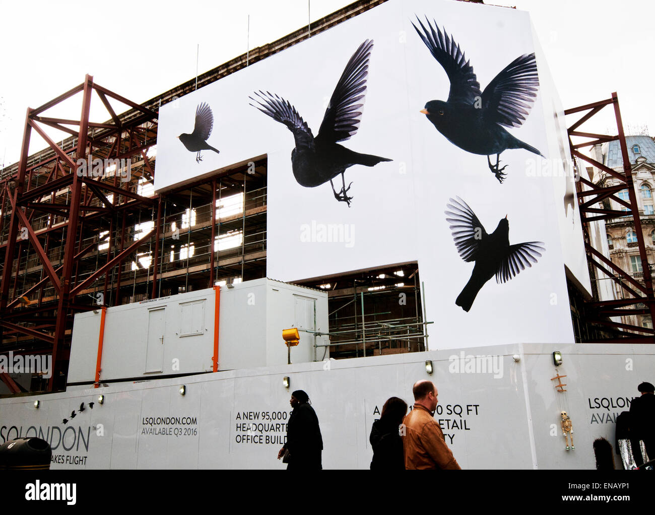 Decorative scaffolding screens Construction site hoarding Stock Photo ...