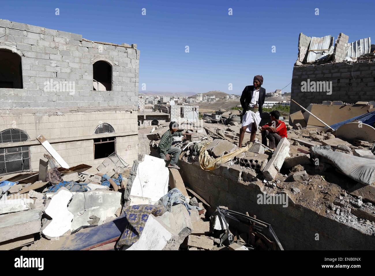 Sanaa, Yemen. 01st May, 2015. People clear rubbles after a residential ...
