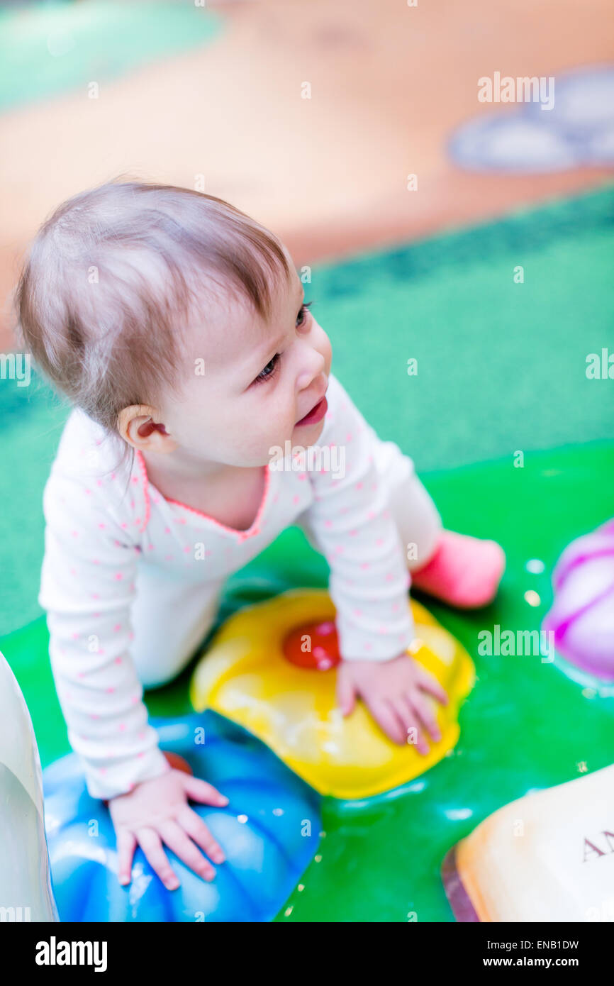 Toddler playing at the indoor toddler playground Stock Photo - Alamy