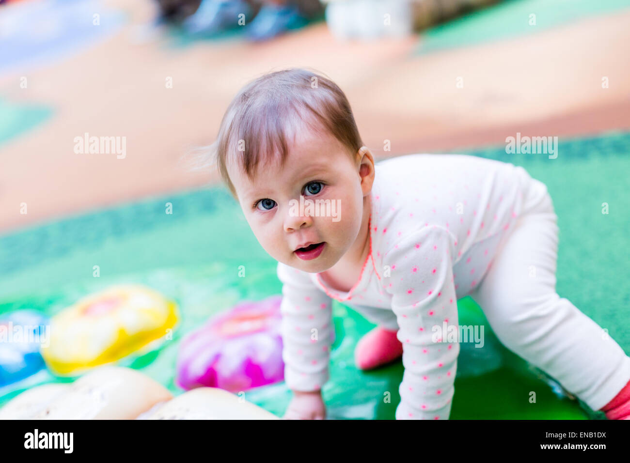 Toddler playing at the indoor toddler playground Stock Photo - Alamy