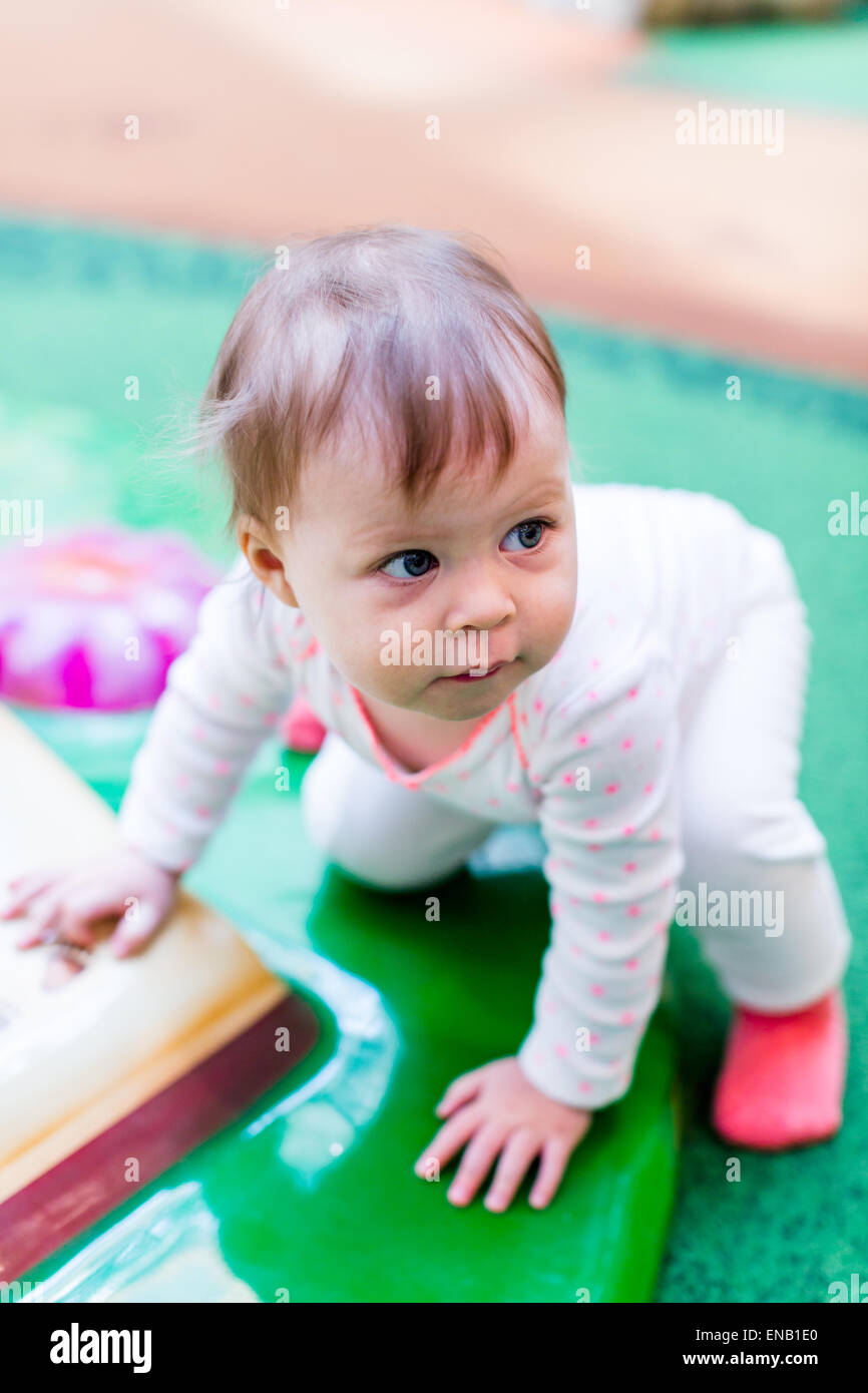 Toddler playing at the indoor toddler playground Stock Photo - Alamy