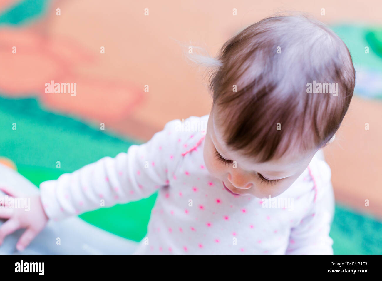 Toddler playing at the indoor toddler playground Stock Photo - Alamy