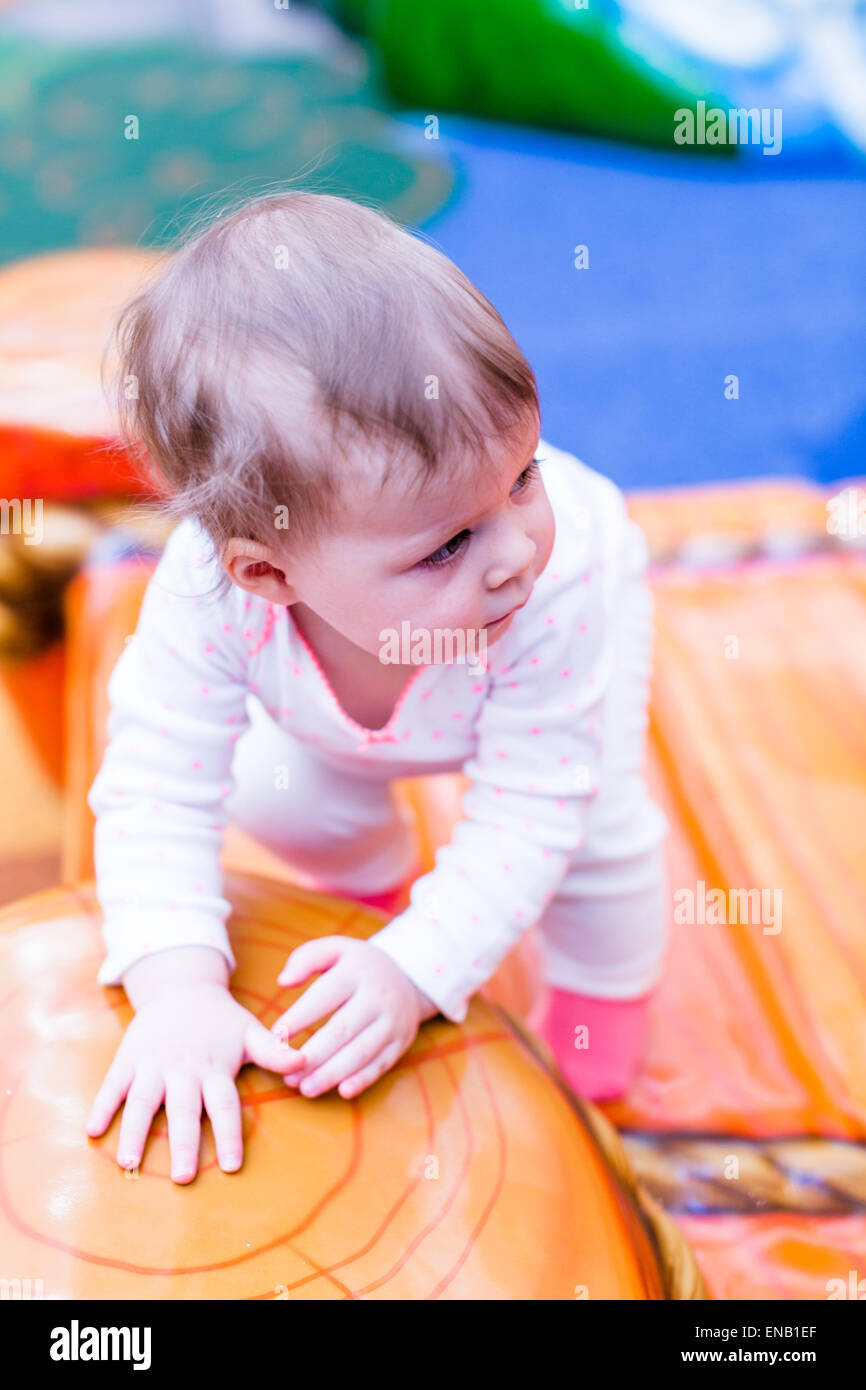 Toddler playing at the indoor toddler playground Stock Photo - Alamy