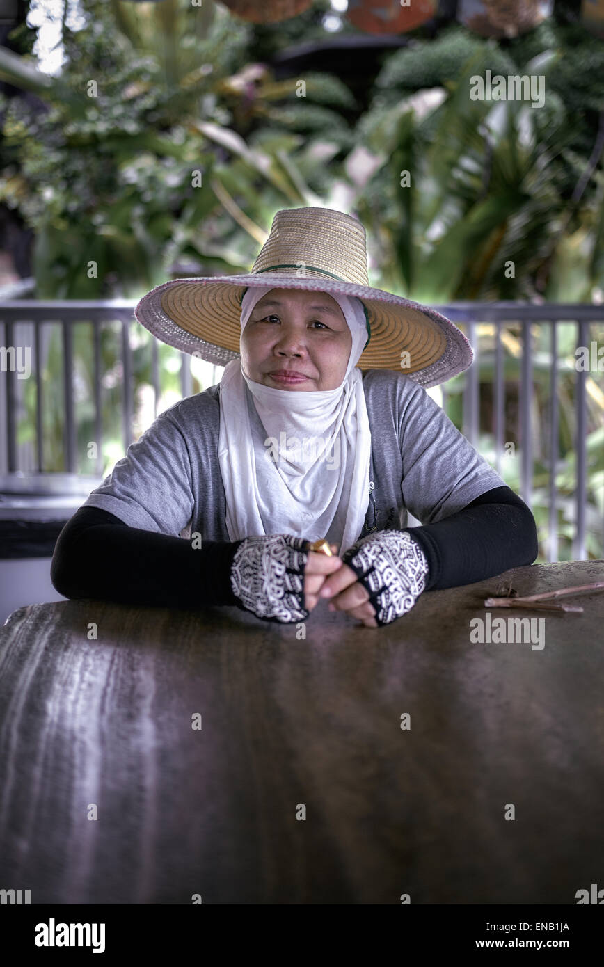 Thailand woman, working class, wearing traditional straw hat and face ...