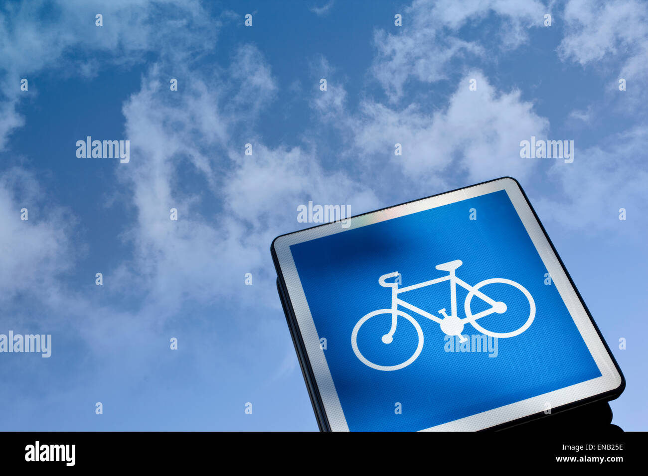 Close up of a bike sign, blue sky background Stock Photo - Alamy