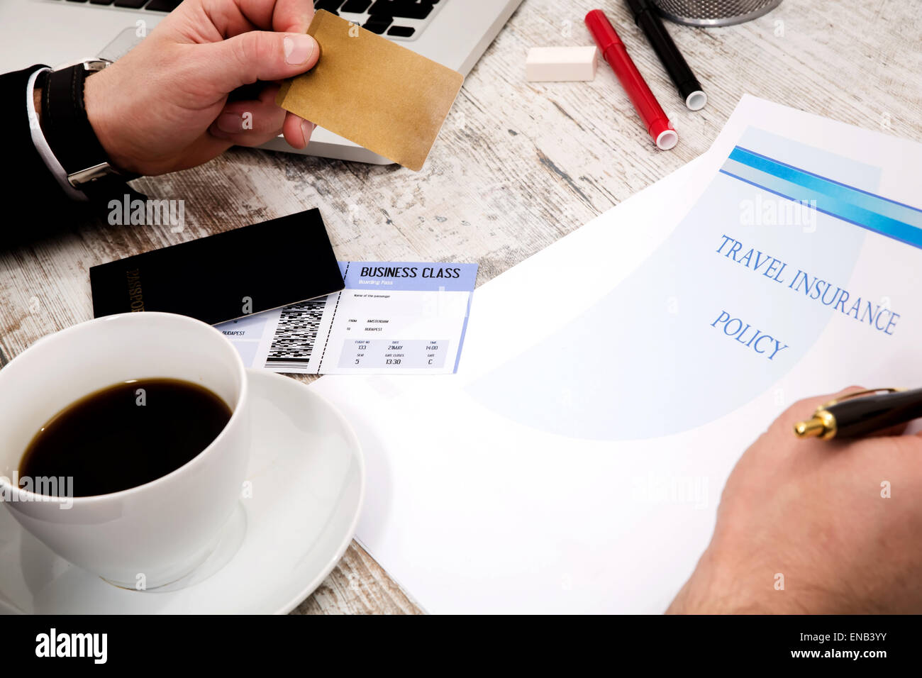 Travel insurance policy booklet with a boarding pass and a passport ...