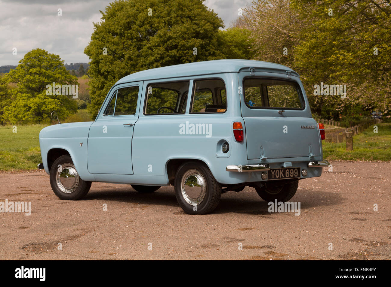 Ford 100E Escort Estate, Baby Blue in parkland with trees and a blue ...