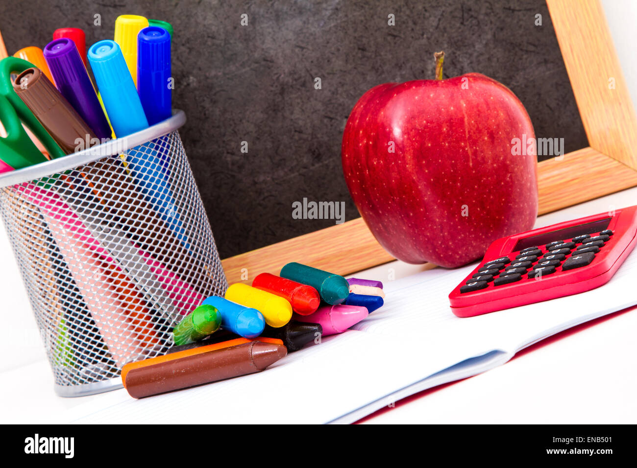 Doing homework with crayons and calculator Stock Photo - Alamy