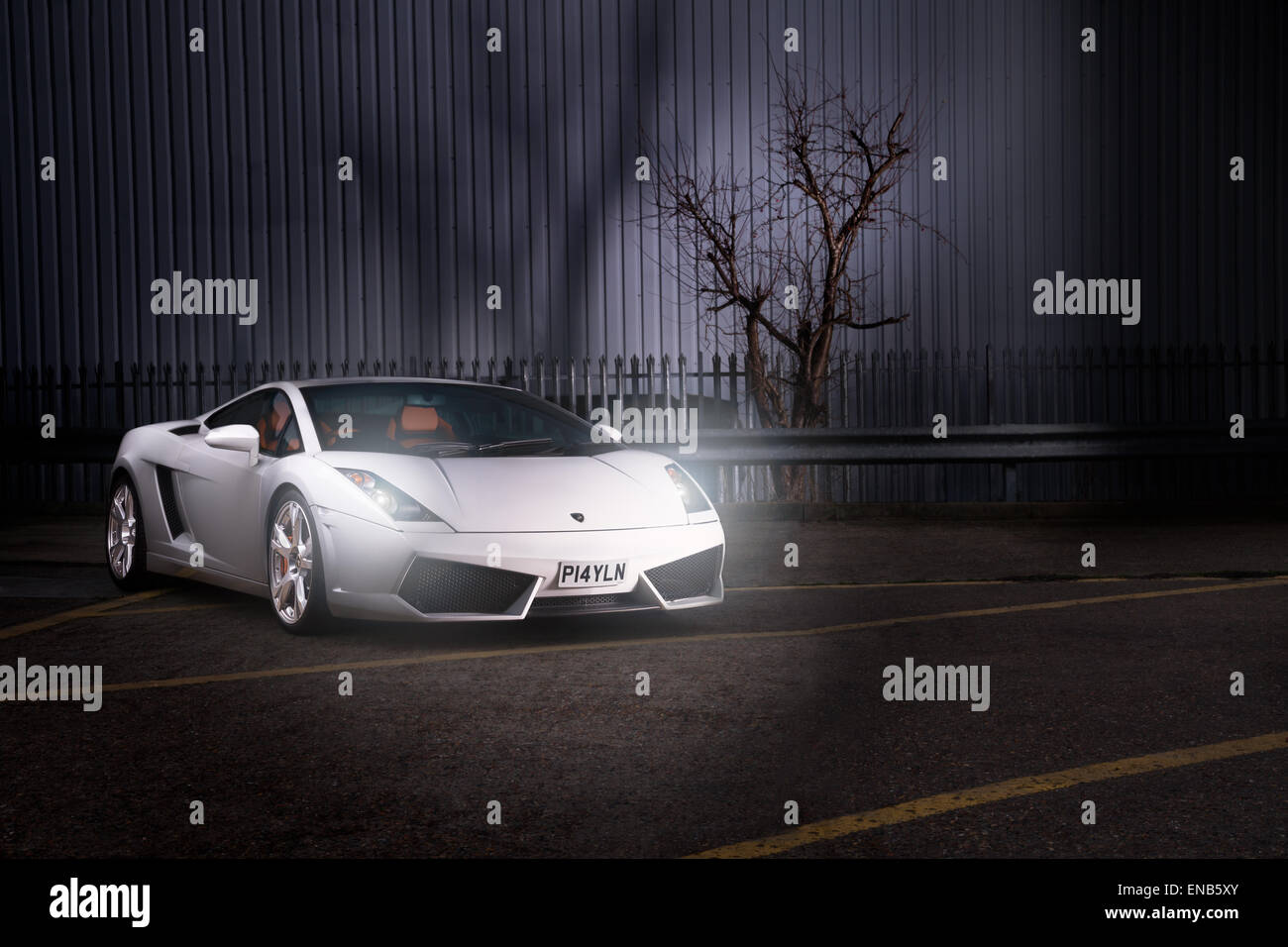 Lamborghini Gallardo in white sat against an industrial background ...