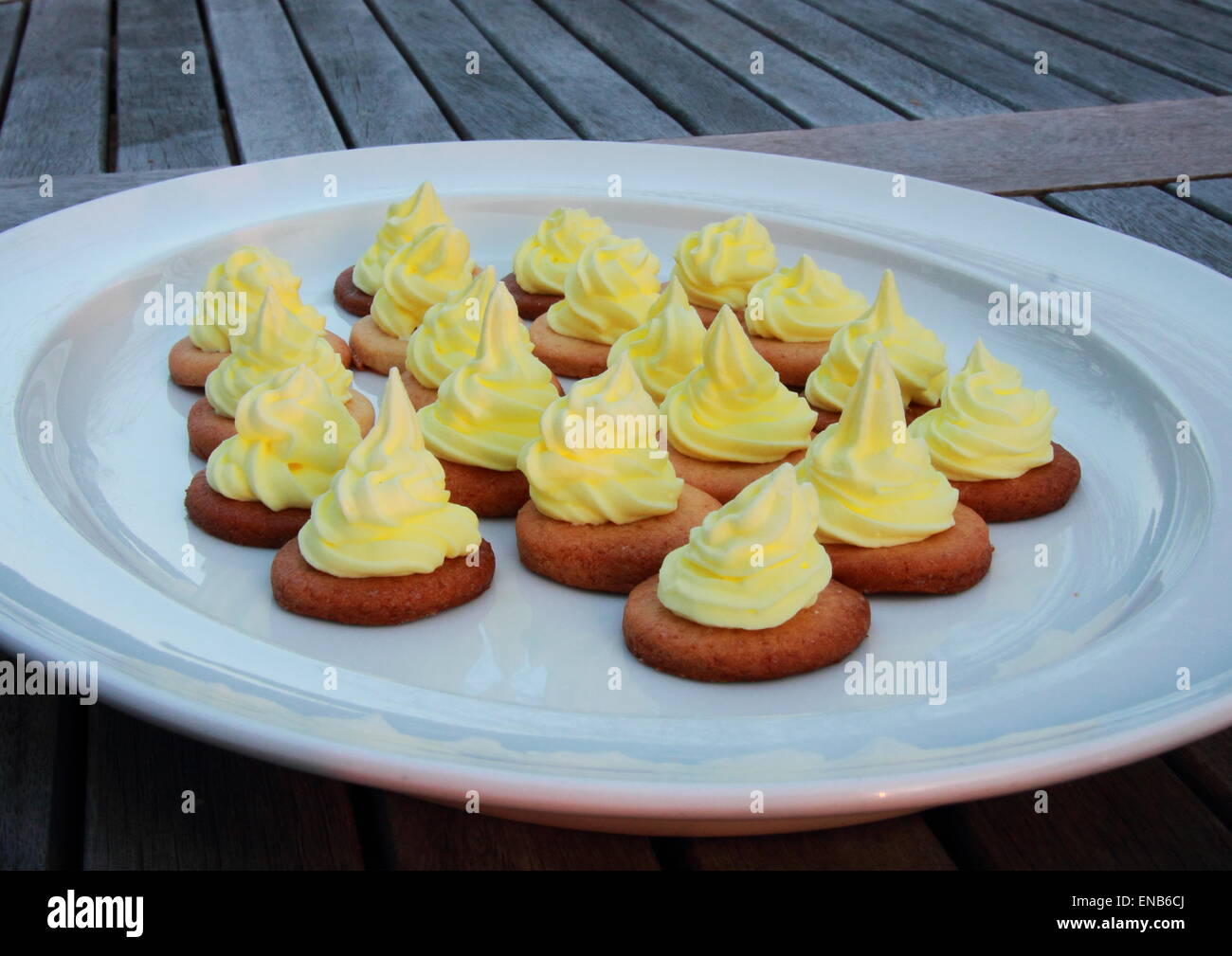 Crusty biscuit with yellow meringue on top Stock Photo - Alamy