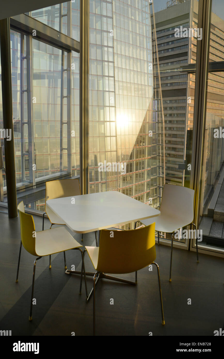Table and chairs looking out at The Shard as golden sun lights the ...