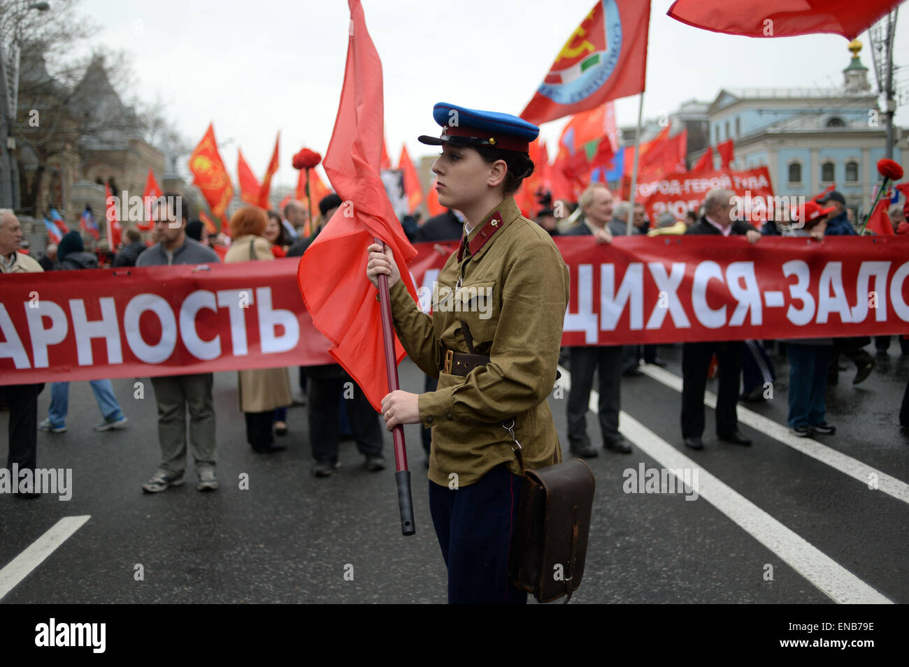 Moscow, Russia. 1st May, 2015. A woman takes part in a parade in Moscow ...