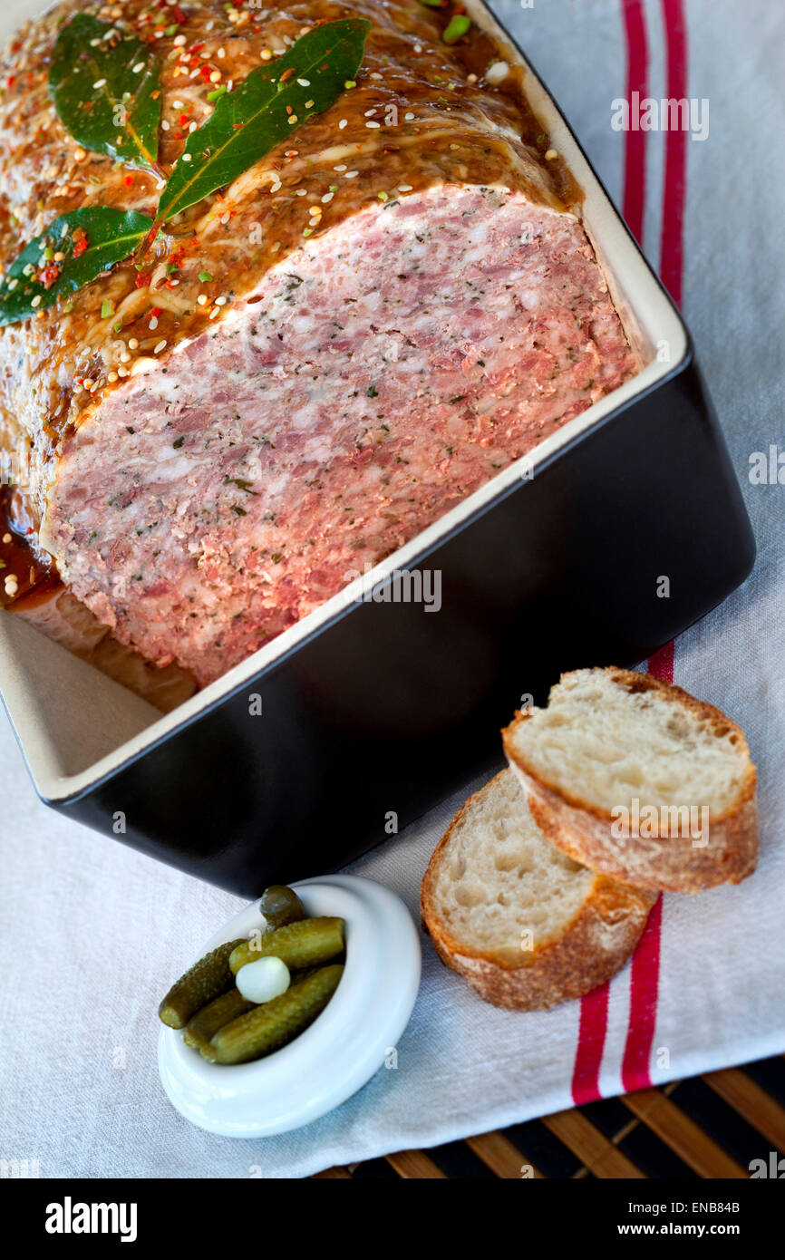 Pork pie, gherkin and bread on a napkin Stock Photo - Alamy
