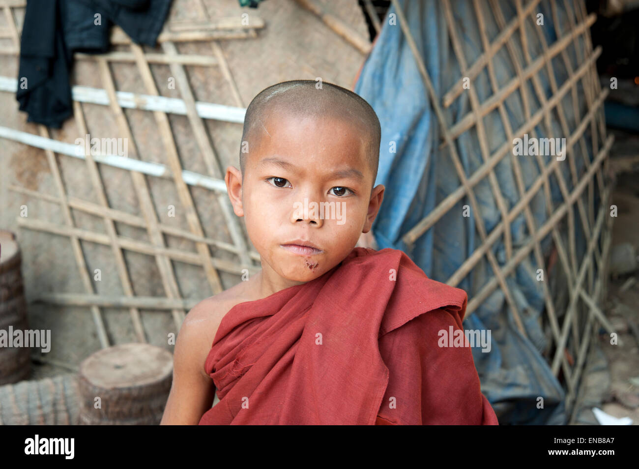 Portrait of a boy monk in front of wooden shack home Myanmar Stock ...
