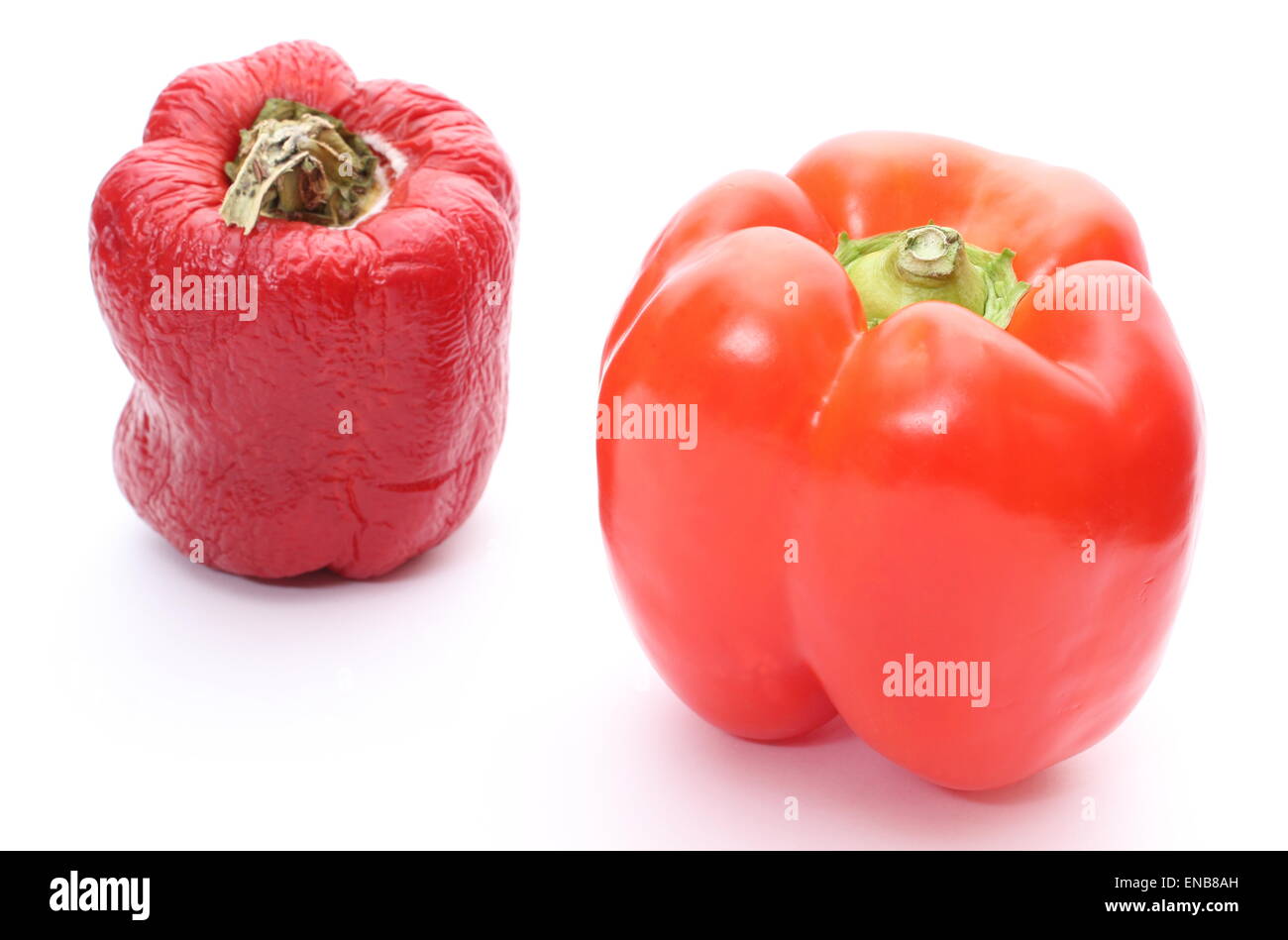 Two peppers - fresh and wrinkled. Isolated on white background Stock ...