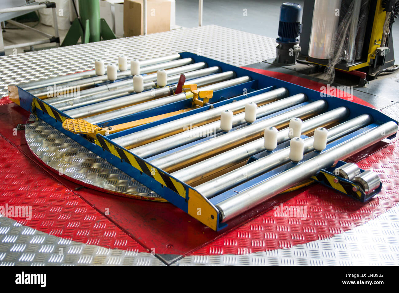 Turntable for wrapping pallets with stretch film Stock Photo - Alamy