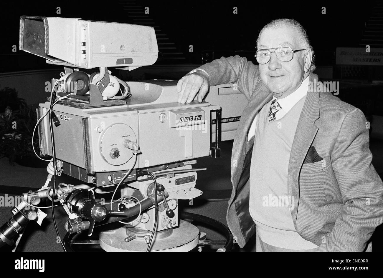 BBC snooker commentator Ted Lowe standing beside a television camera ...