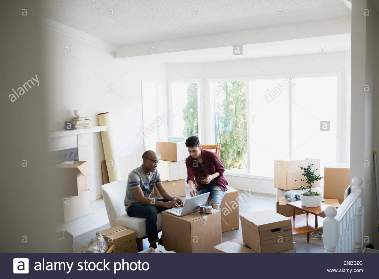 Person surrounded by boxes hi-res stock photography and images - Alamy
