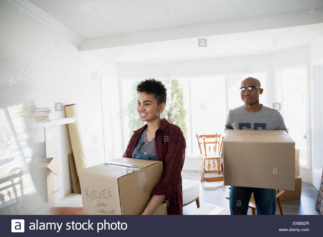 Two men carrying boxes hi-res stock photography and images - Alamy