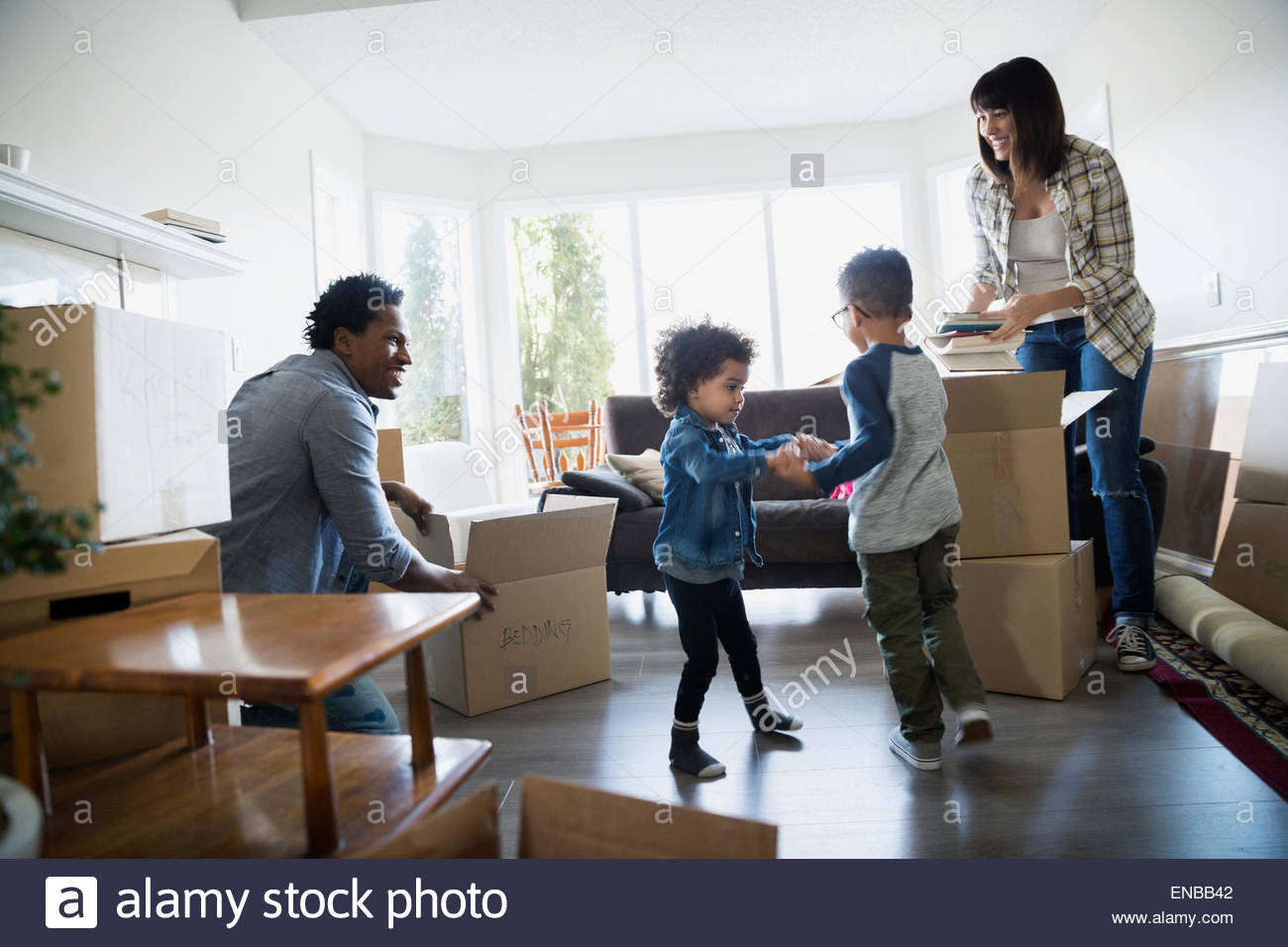 Mother son unpacking moving boxes hi-res stock photography and images ...