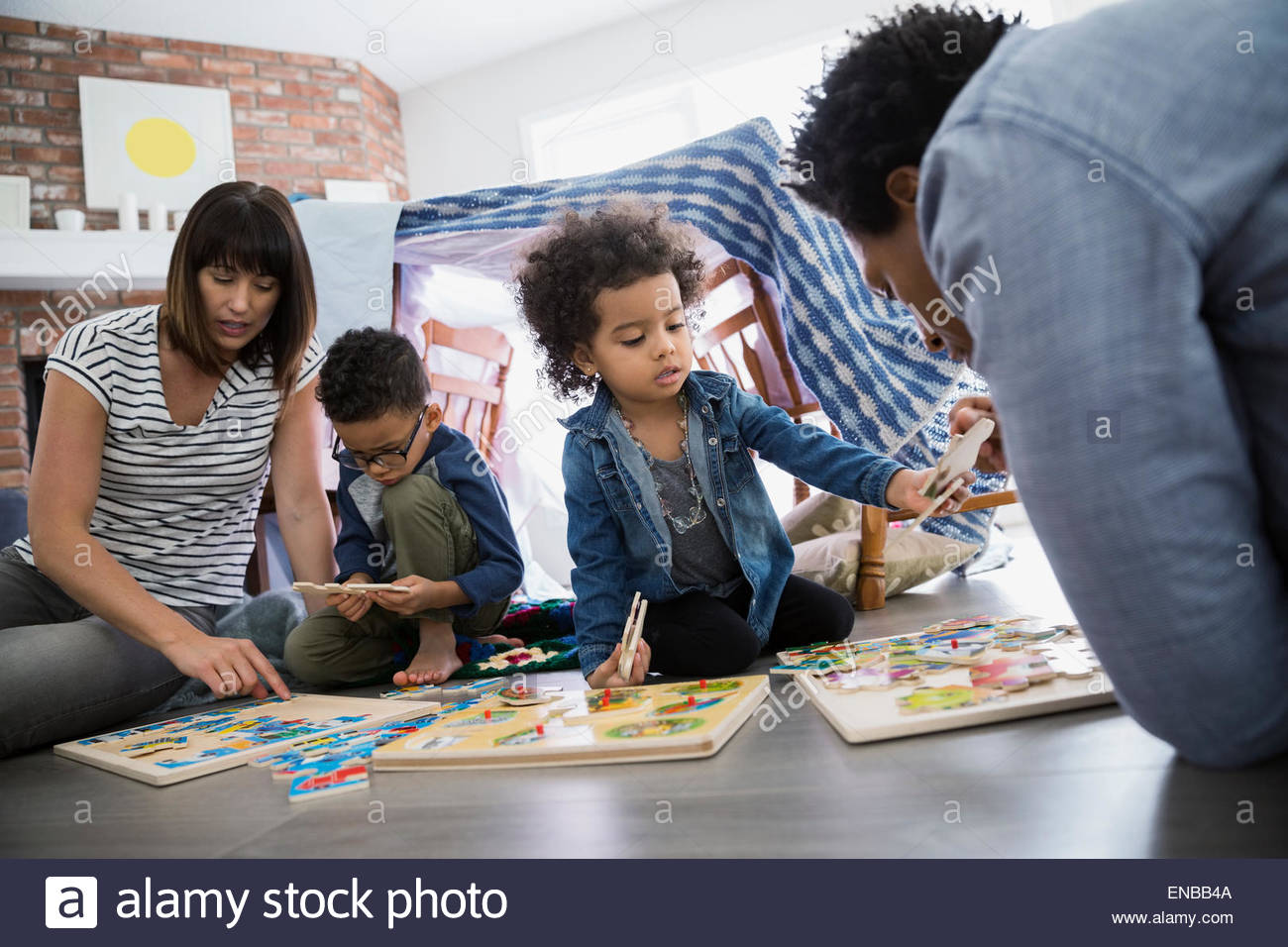 Children playing together jigsaw puzzle hi-res stock photography and ...