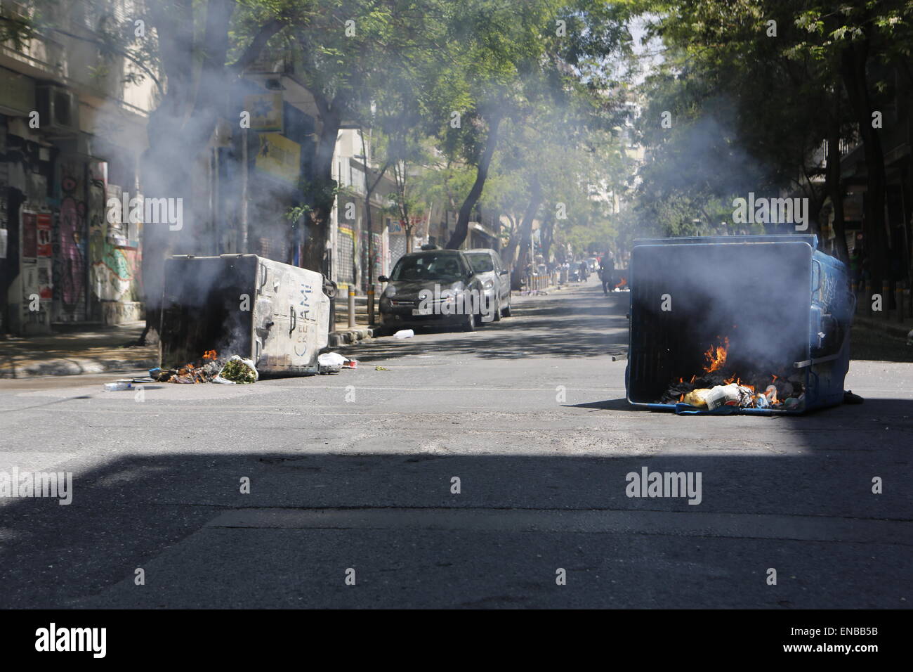 Athens, Greece. 1st May 2015. Burning rubbish bins are used as road ...