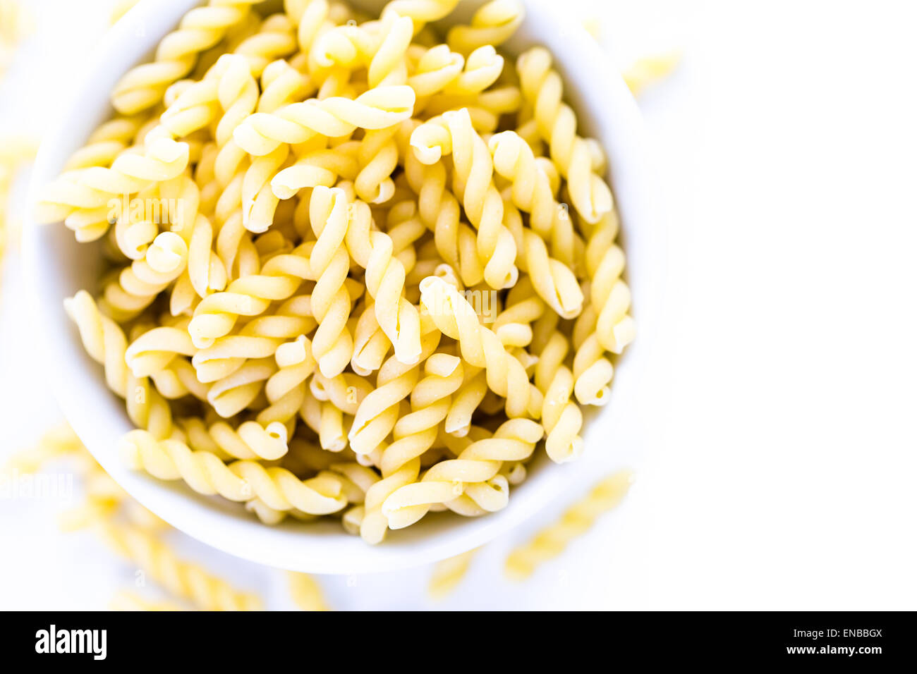 Organic dry pasta on a white background Stock Photo - Alamy