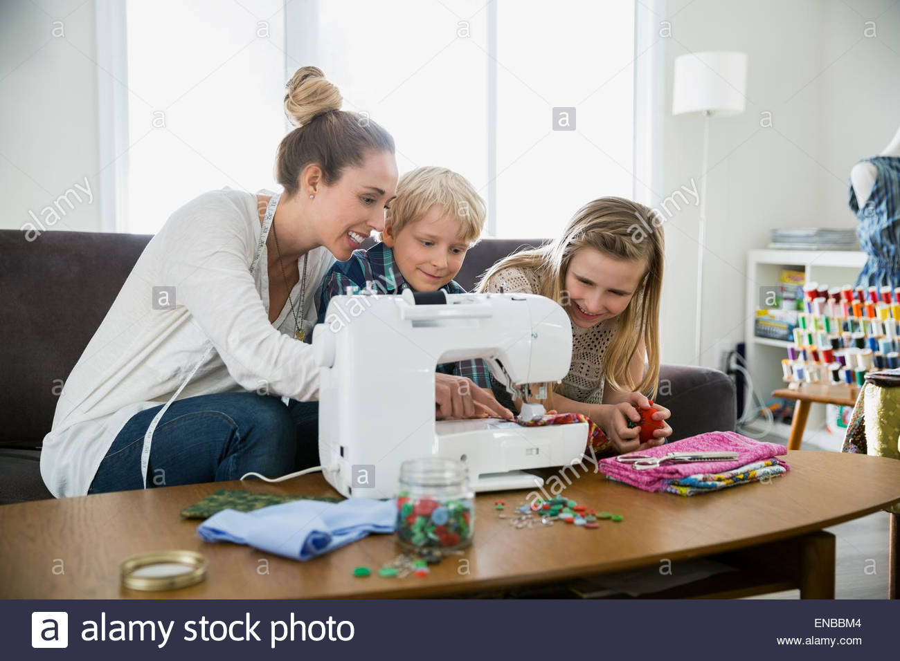 Girls together sewing hi-res stock photography and images - Alamy