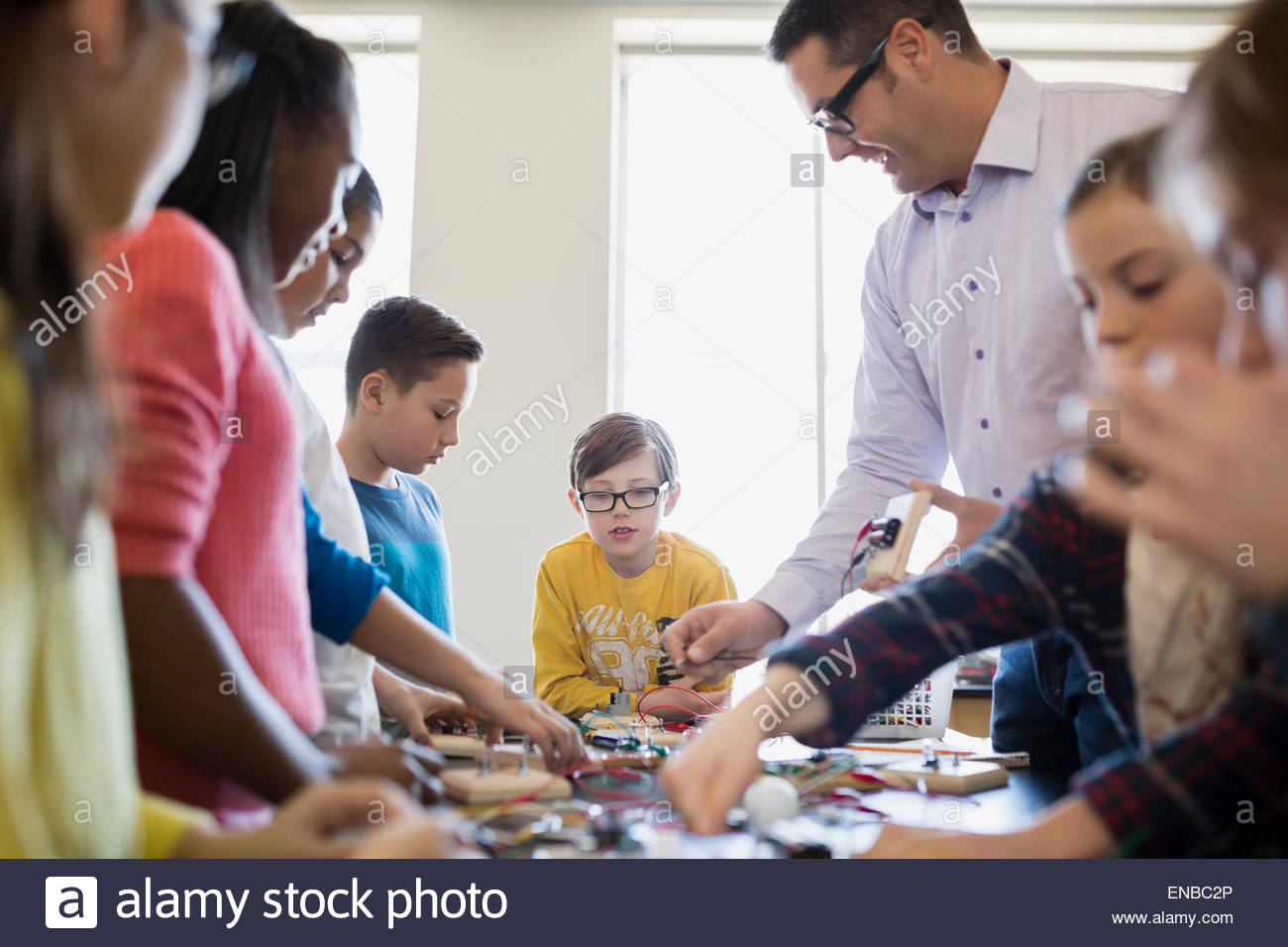 Group students table teacher hi-res stock photography and images - Alamy