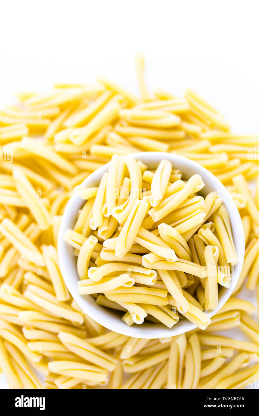 Organic dry pasta on a white background Stock Photo - Alamy