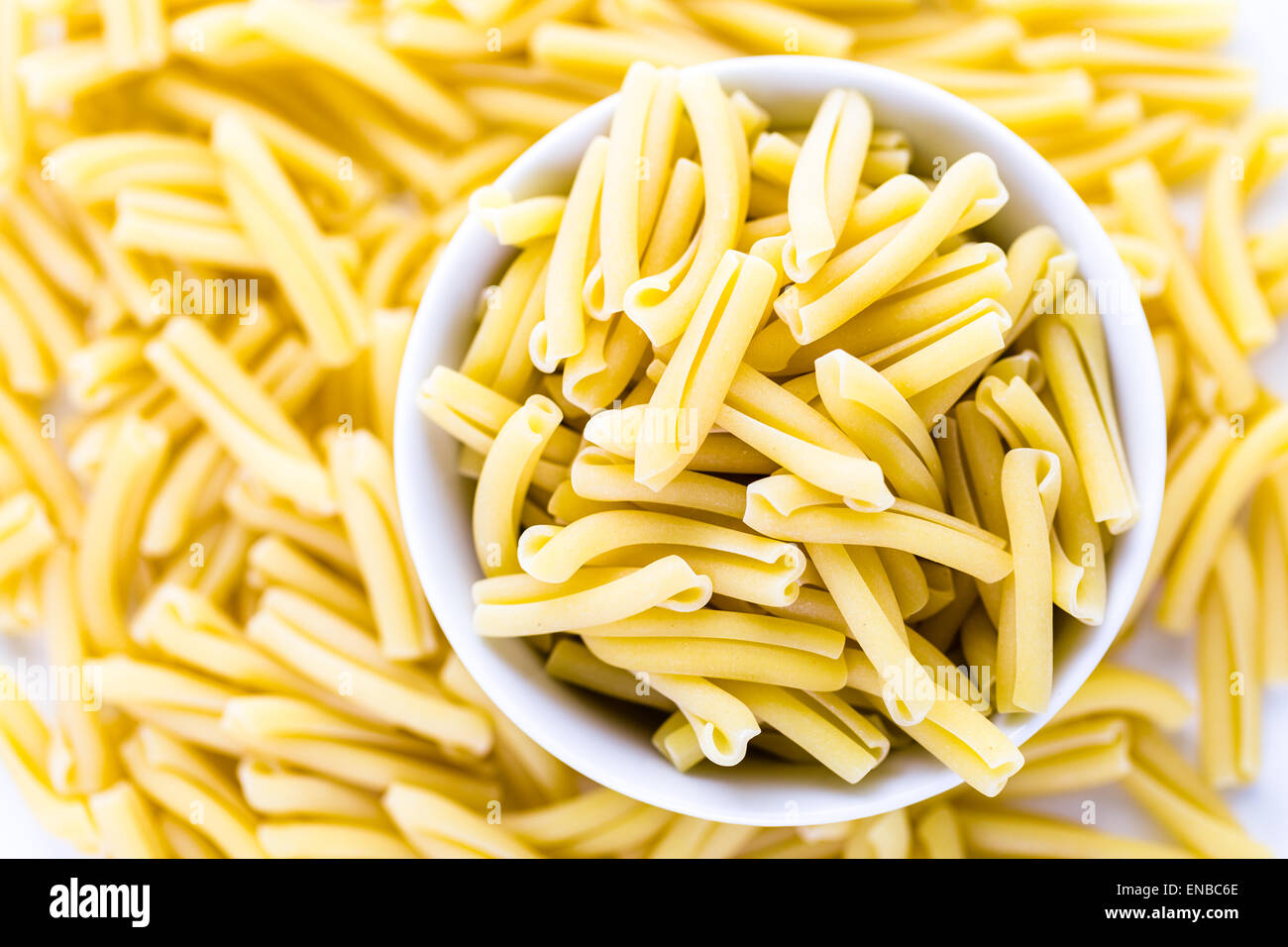Organic dry pasta on a white background Stock Photo - Alamy