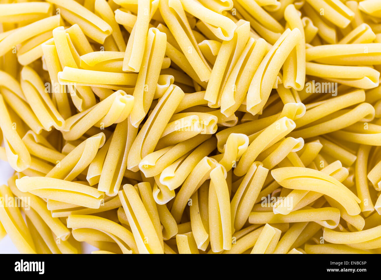 Organic dry pasta on a white background Stock Photo - Alamy