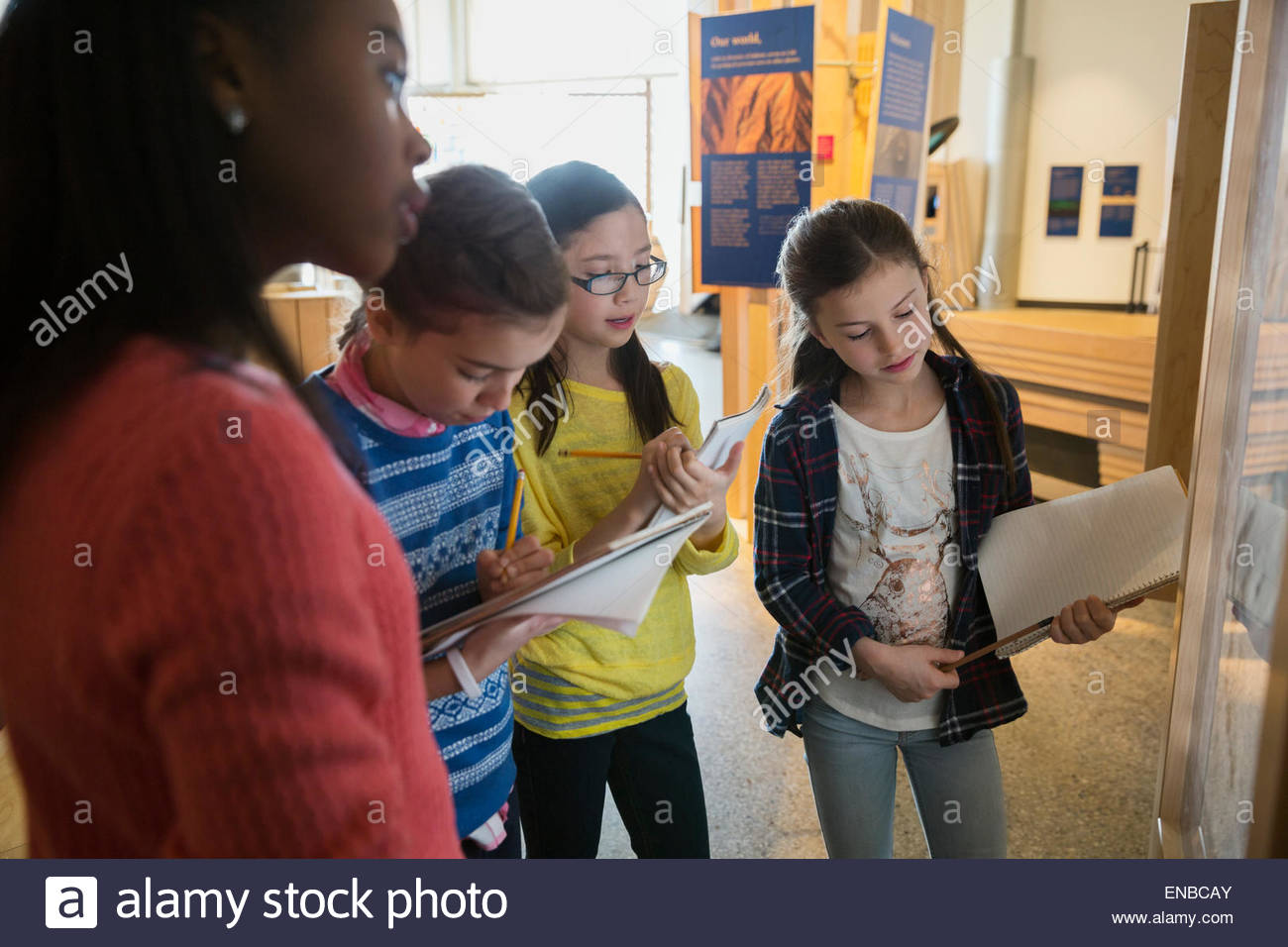 Students taking notes geology exhibit at science center Stock Photo - Alamy