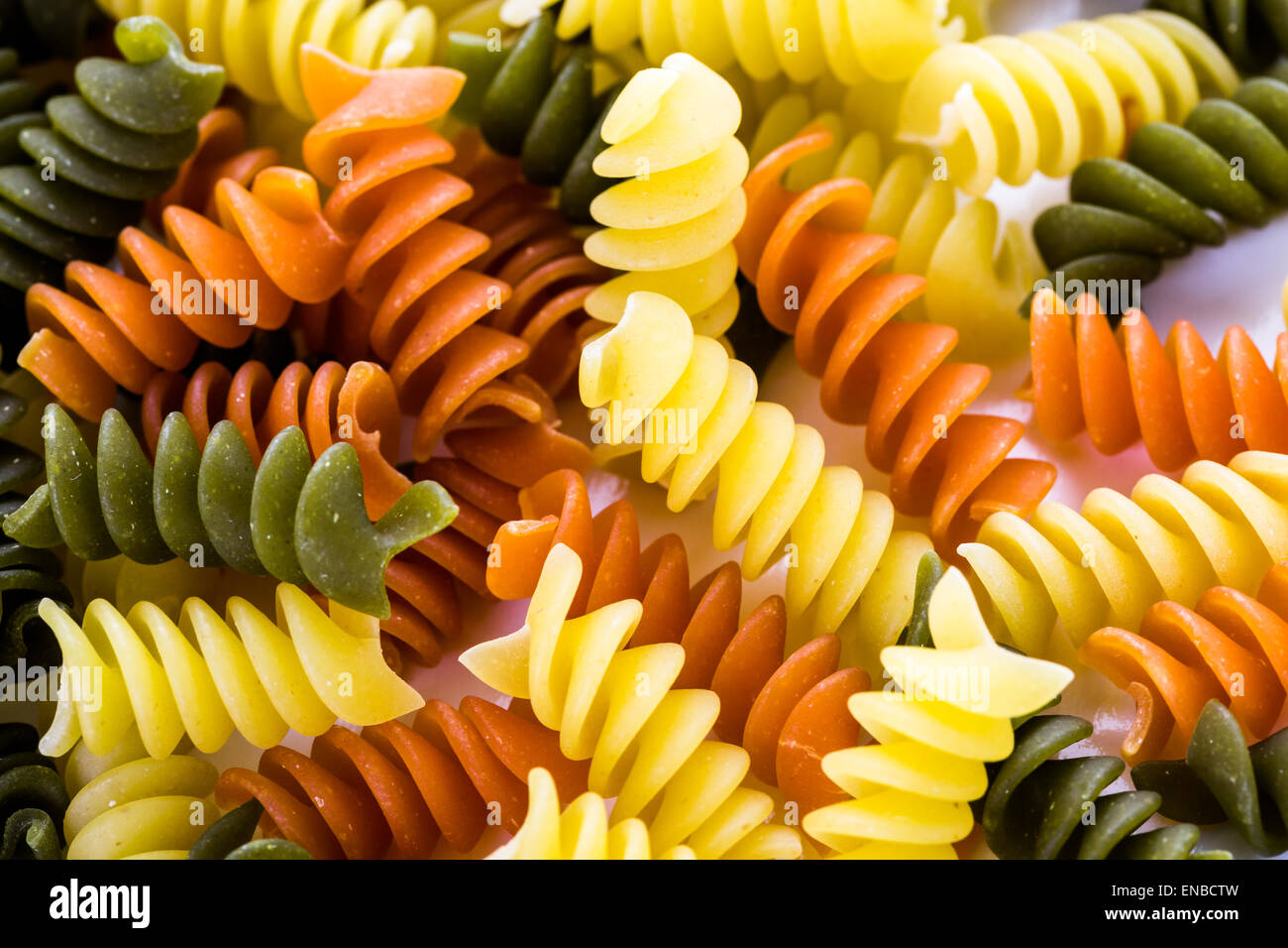 Organic dry pasta on a white background Stock Photo - Alamy