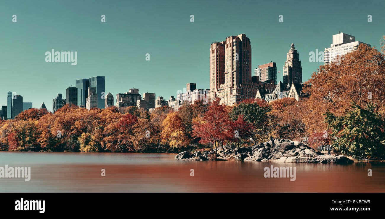 Central Park Autumn and midtown skyline over lake in Manhattan New York ...