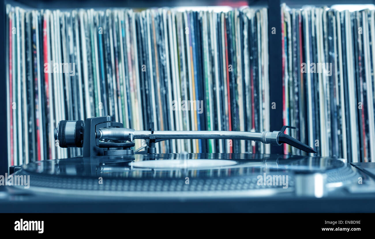 Dj turntable on vinyl background, closeup Stock Photo - Alamy