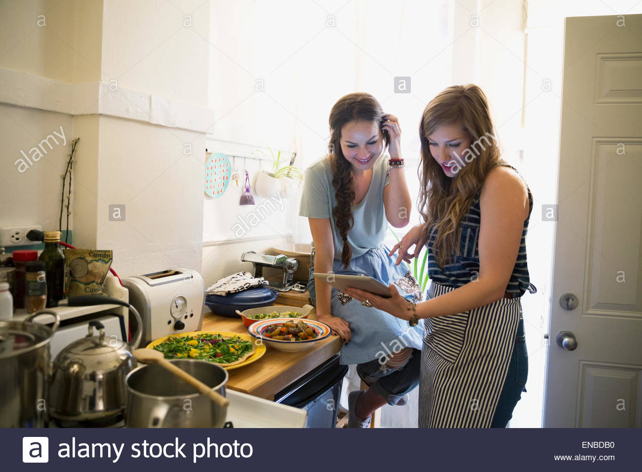 Two friends cooking hi-res stock photography and images - Alamy