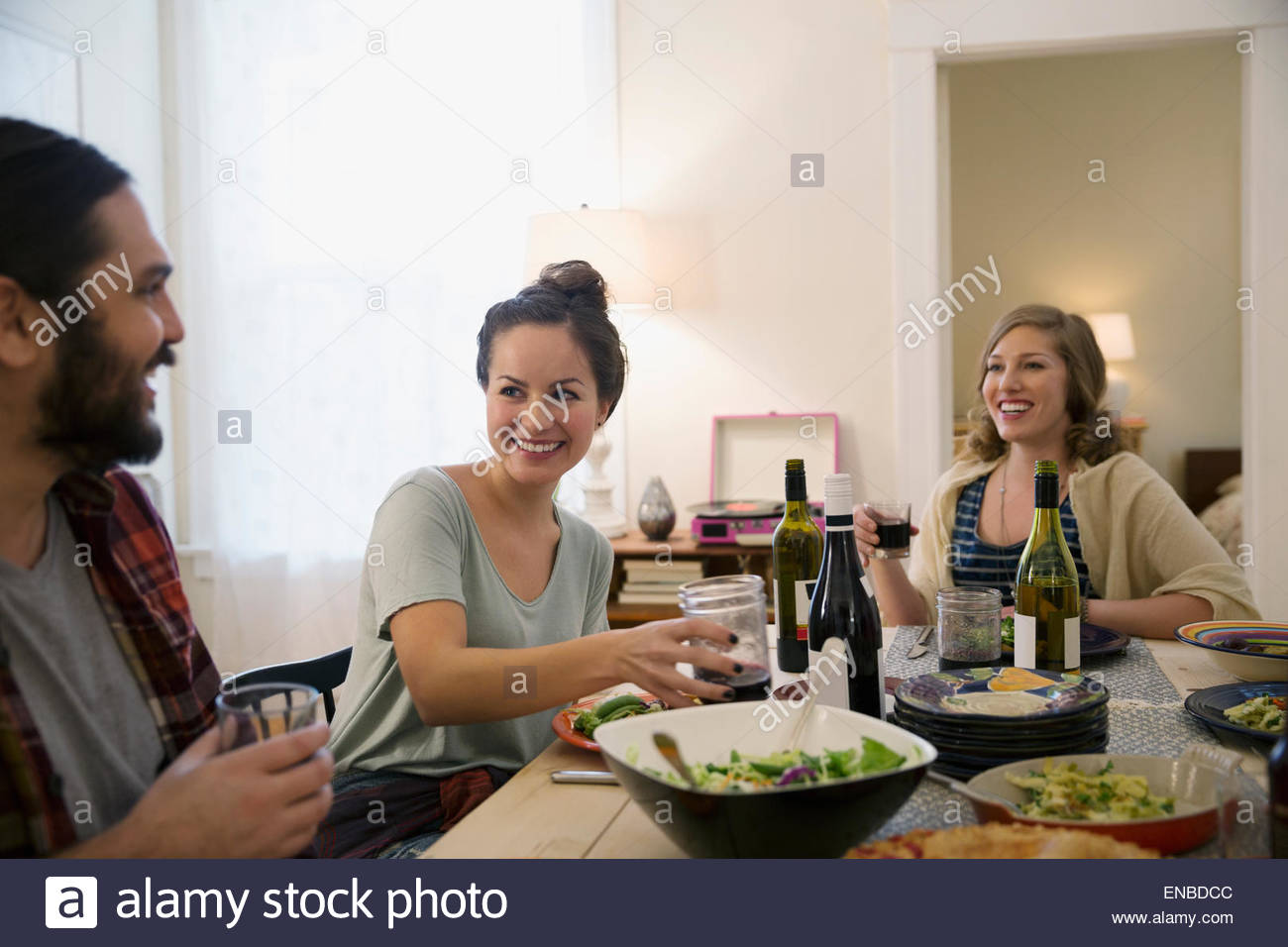 Smiling friends talking at dinner party hi-res stock photography and ...