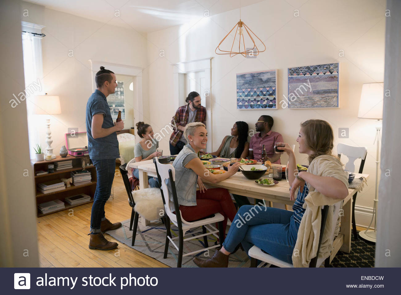 Smiling friends talking at dinner party hi-res stock photography and ...