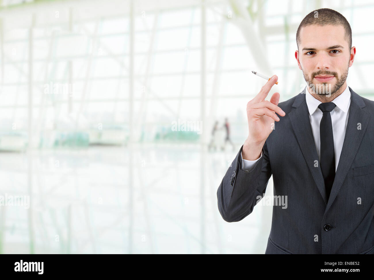 businessman smoking at the office Stock Photo - Alamy