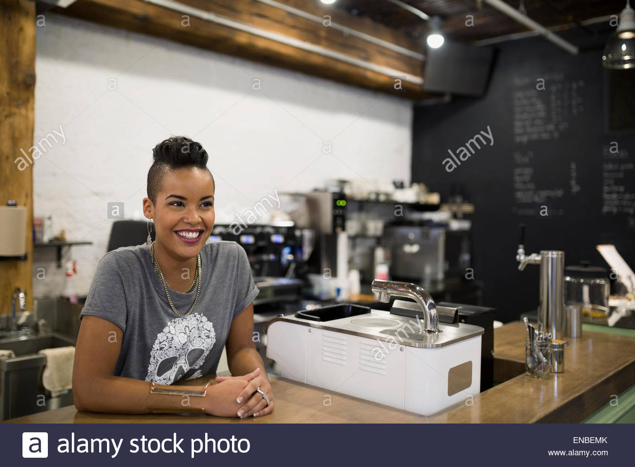Smiling barista at coffee shop counter Stock Photo - Alamy