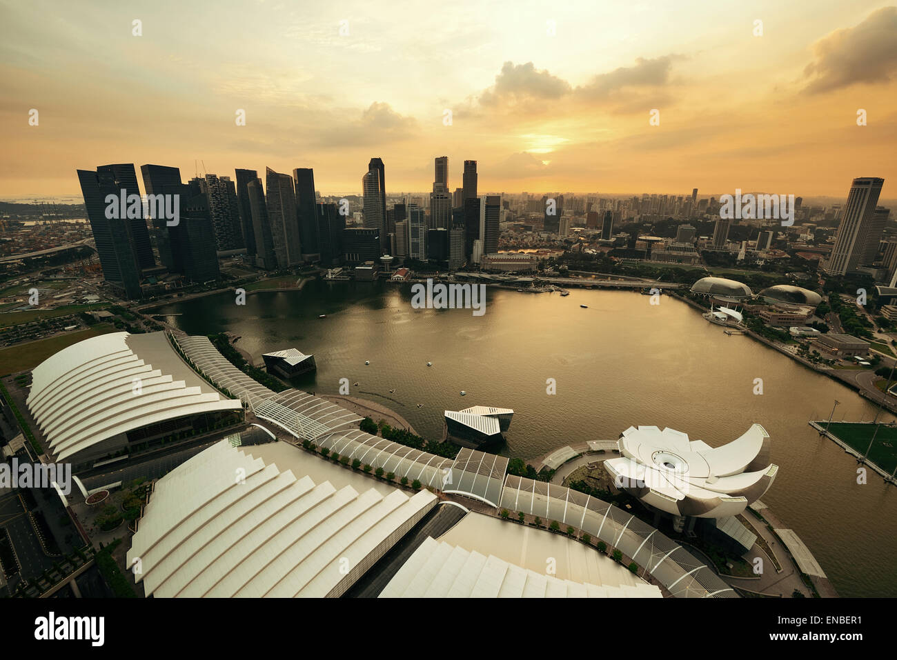 Singapore rooftop view of Marina Bay with urban skyscrapers at sunset ...
