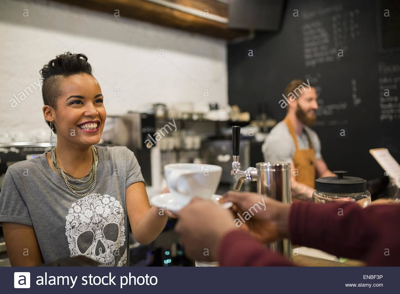 Barista serving coffee hi-res stock photography and images - Alamy